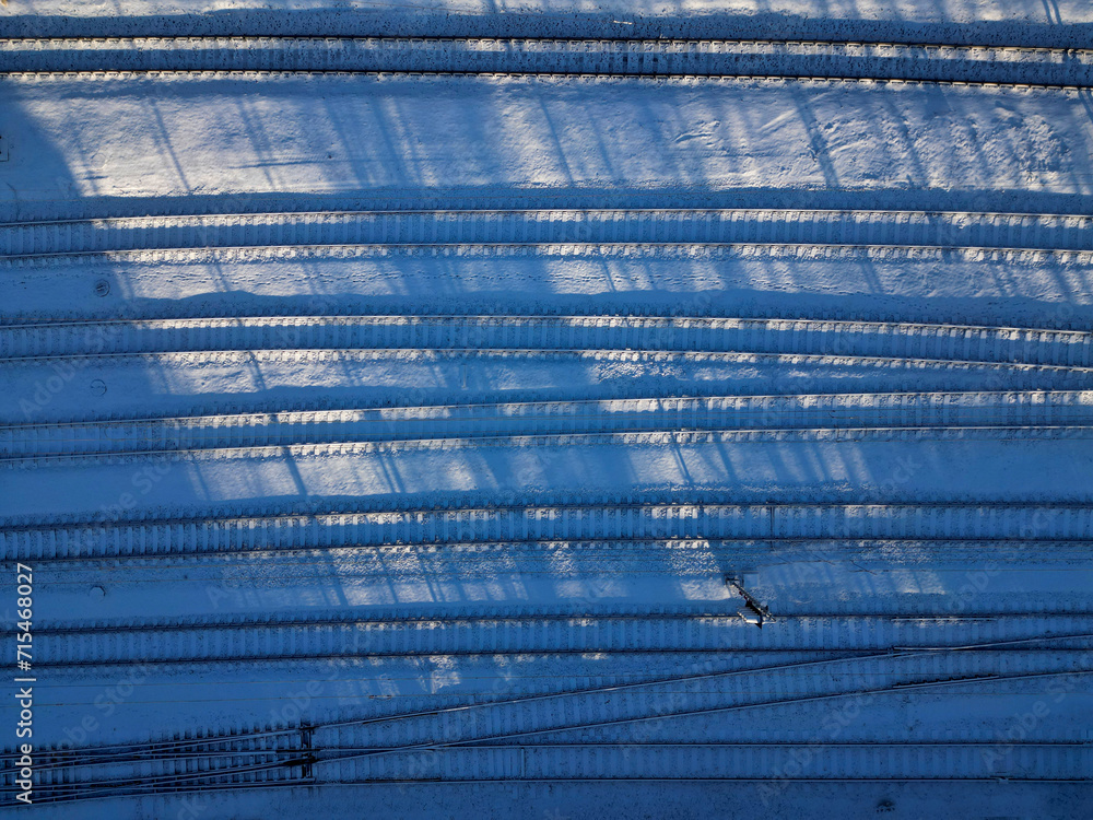 railway tracks to a multi-track sorting train station. vertical view ...