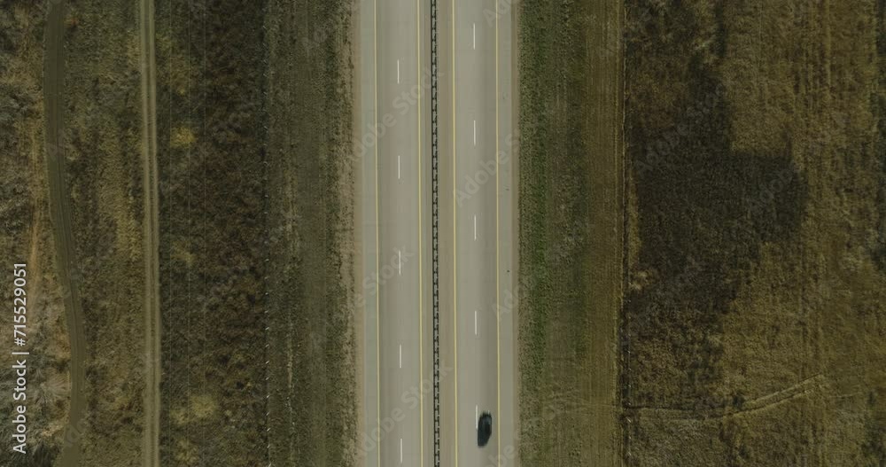 One black and white car driving alone, lifestyle travel on empty ...