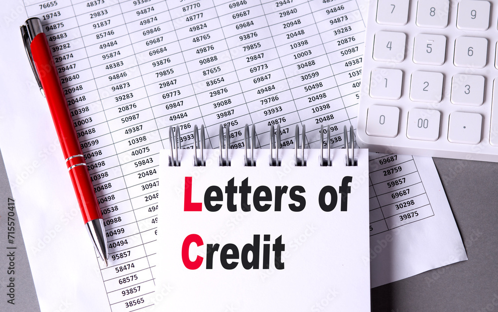 LETTER OF CREDIT text on notebook with pen, calculator and chart on ...