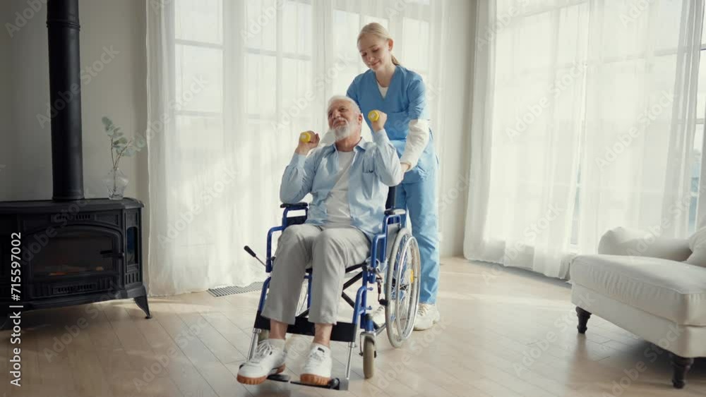 Nurse woman cares old man in wheelchair. Paralyzed elderly man does ...
