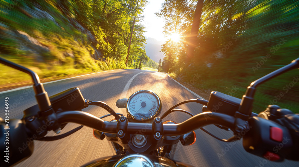 Motorcycle rider speeding on a long open road. Dynamic motion blur ...