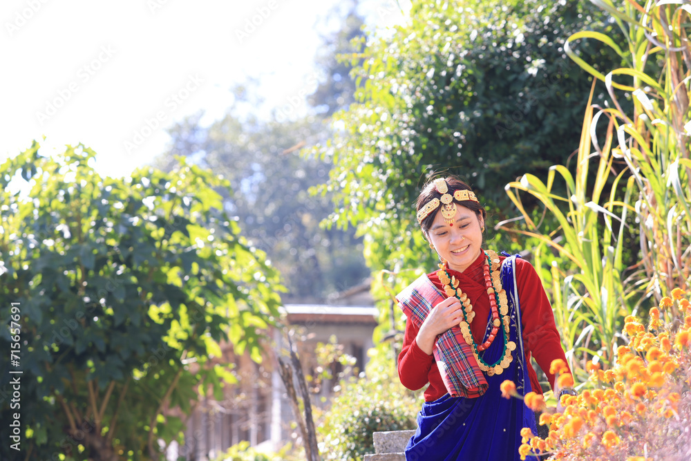 a girl with Gurung traditional dressing a Gurung village in Ghandruk ...