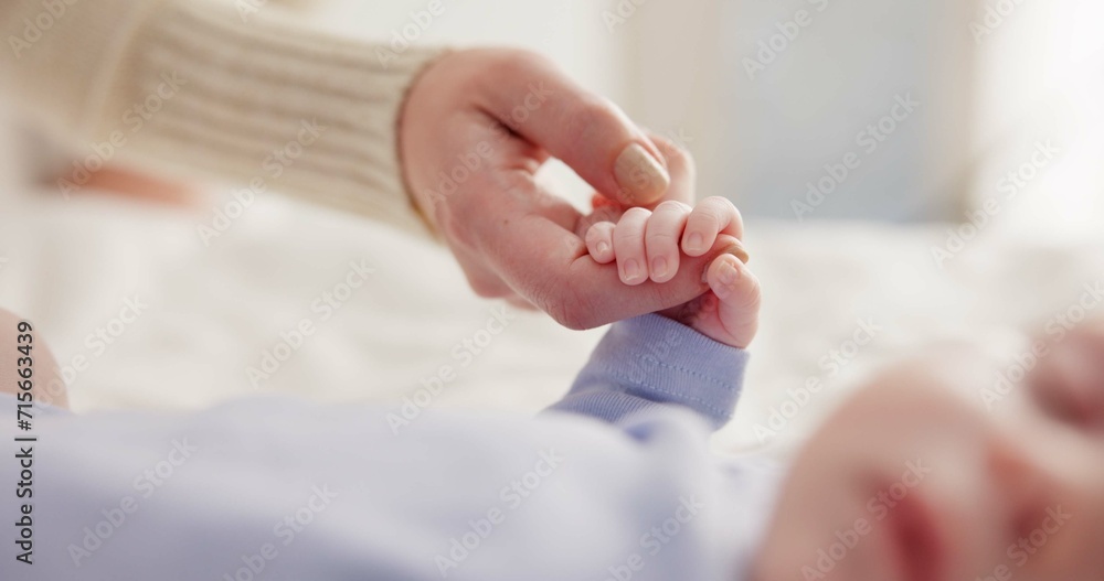 Parents, family and holding hands with baby on bed for bonding, love ...