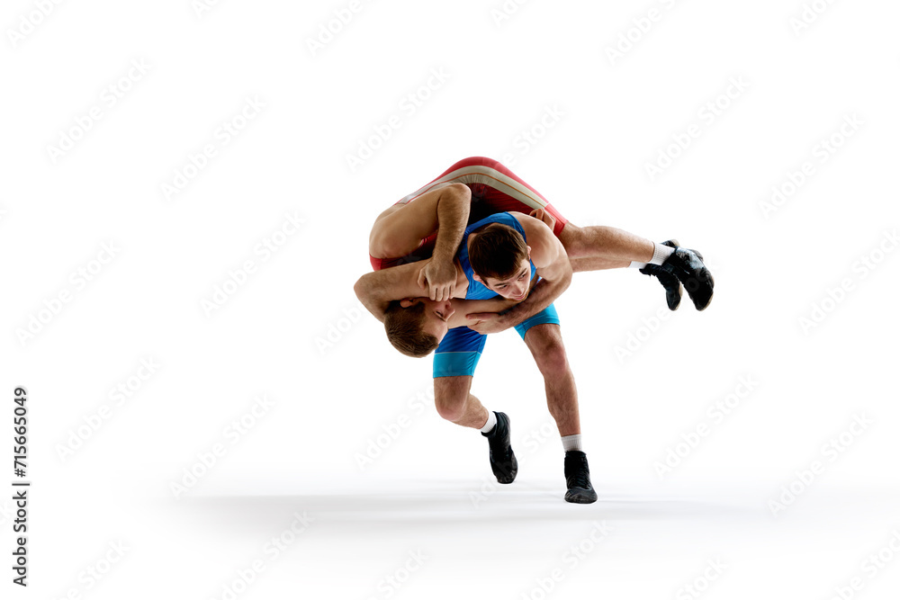 Two strong and skilled wrestlers in blue and red wrestling uniform ...
