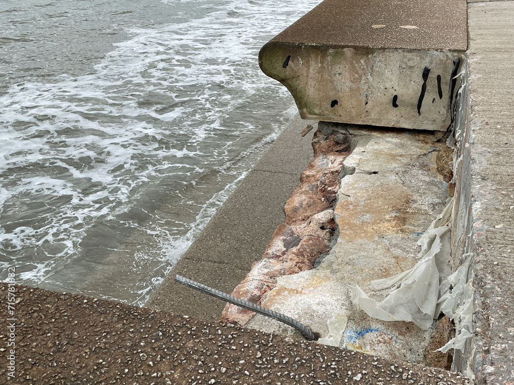Destruction and damage of sea wall defensive structure and wave ...