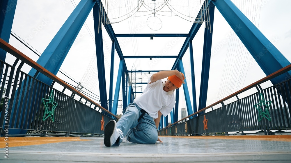 Professional break dancer perform street dance footstep at bridge ...