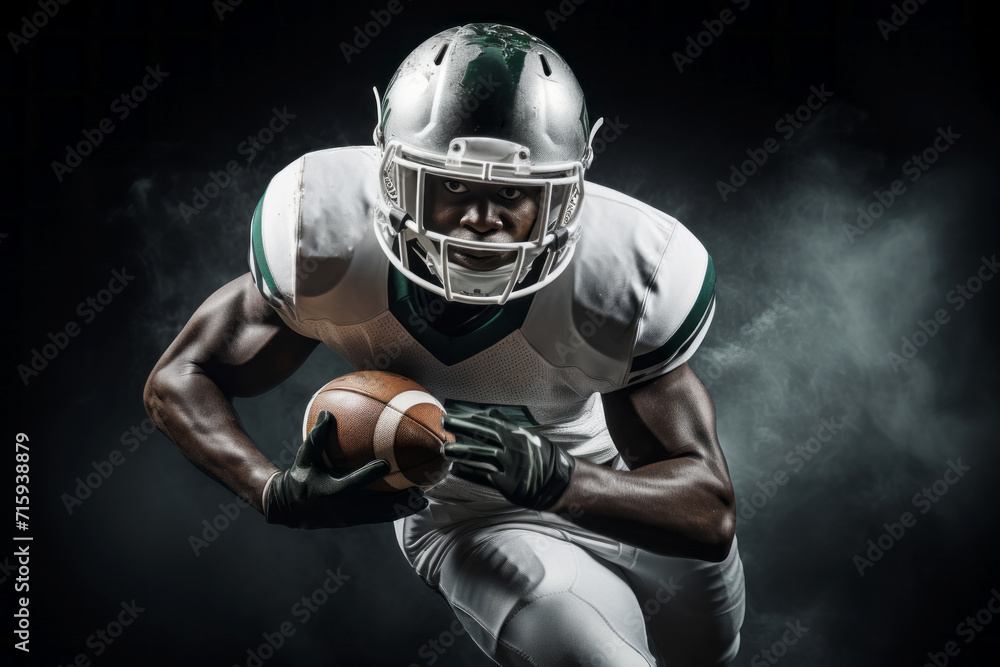 Portrait of American football player running with the ball. Muscular ...