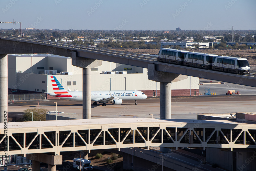 PHX Sky Train on Bridge and an American Airlines Airbus A321 just ...