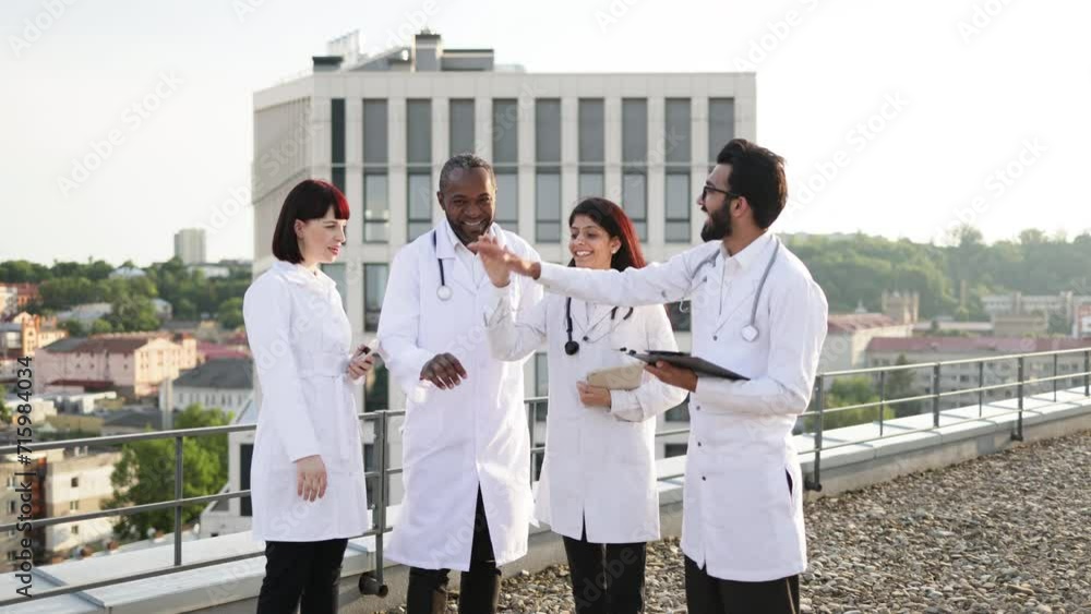 Multinational conference of doctors outdoors on rooftop of modern ...