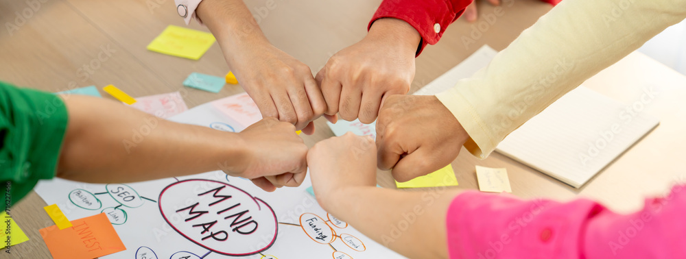 Young happy creative startup group join circle fist bump hands together ...