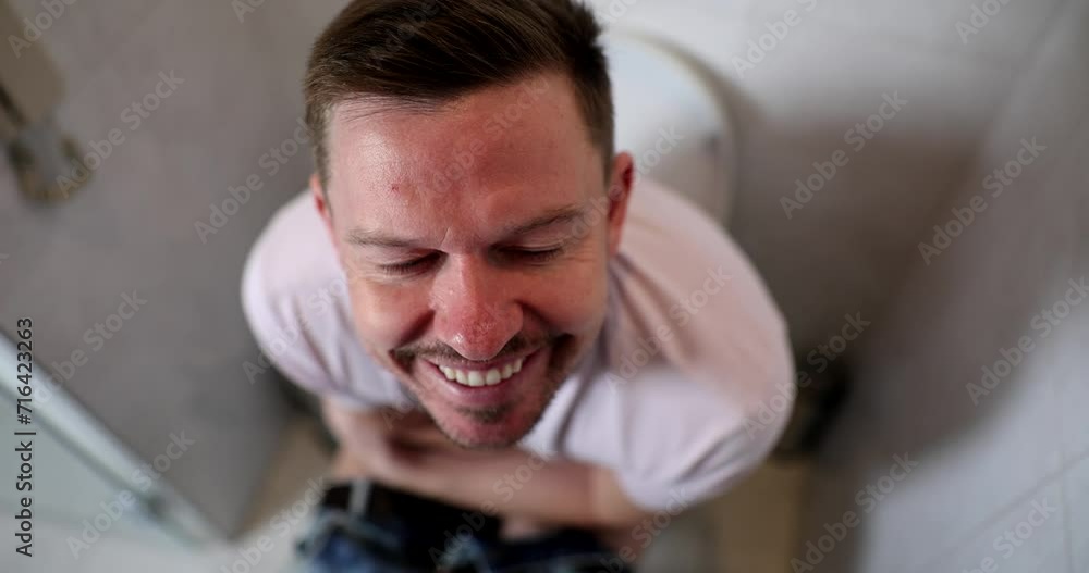 Man stomach ache constipation hemorrhoids sitting on toilet in bathroom ...