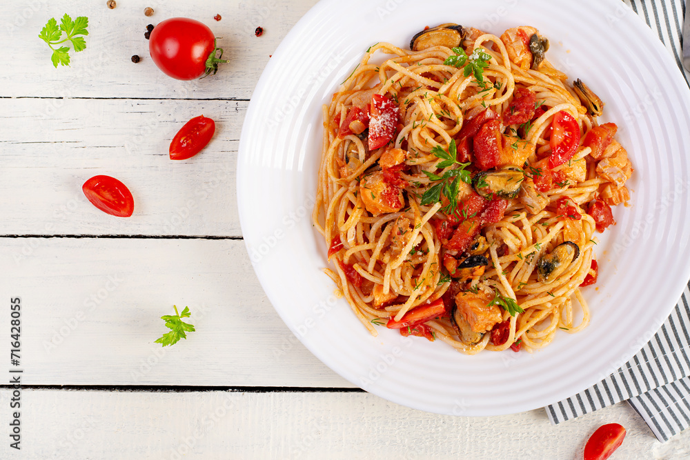 Classic italian pasta spaghetti marinara with mussels and salmon on ...