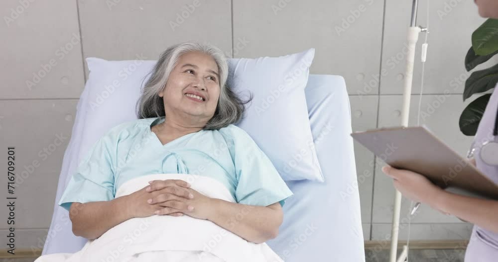 nurse takes care elderly Asian female patient checking and inquiring ...