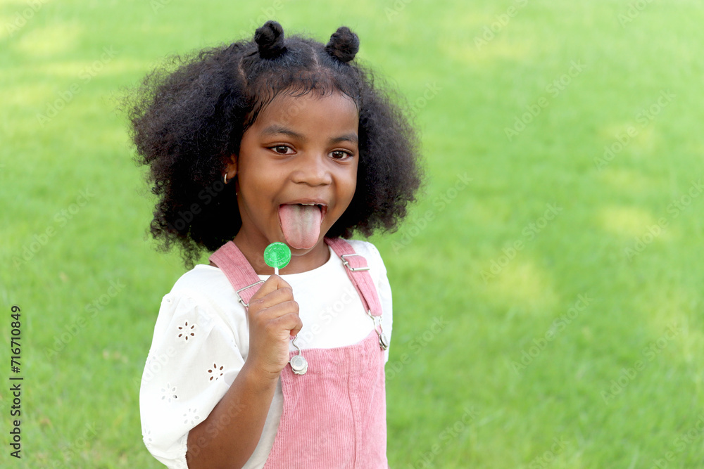 Portrait of happy smiling African girl with black curly hair sticking ...