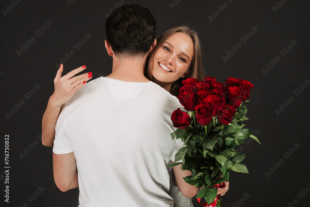Beautiful romantic couple isolated on grey background. Attractive young ...