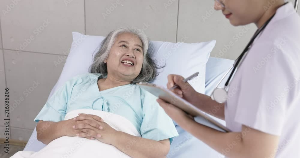 nurse takes care elderly Asian female patient checking and inquiring ...