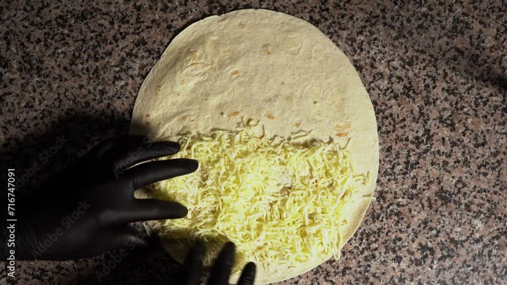 Concept of junk food and eating outdoor. Man cooking traditional wraps ...