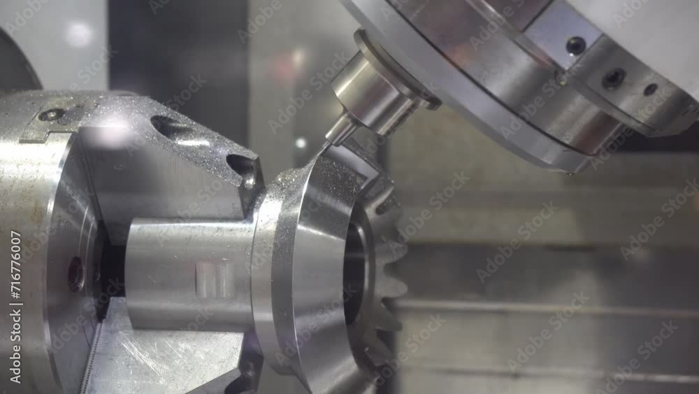 The 5-axis CNC milling machine cutting the automotive part with solid ...