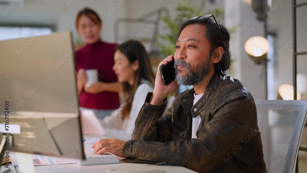 Video Stock focused and dedicated work with asian male man ...