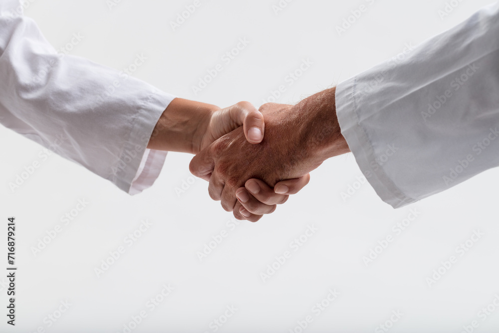Gender-inclusive handshake signifies equality in healthcare Stock Photo ...