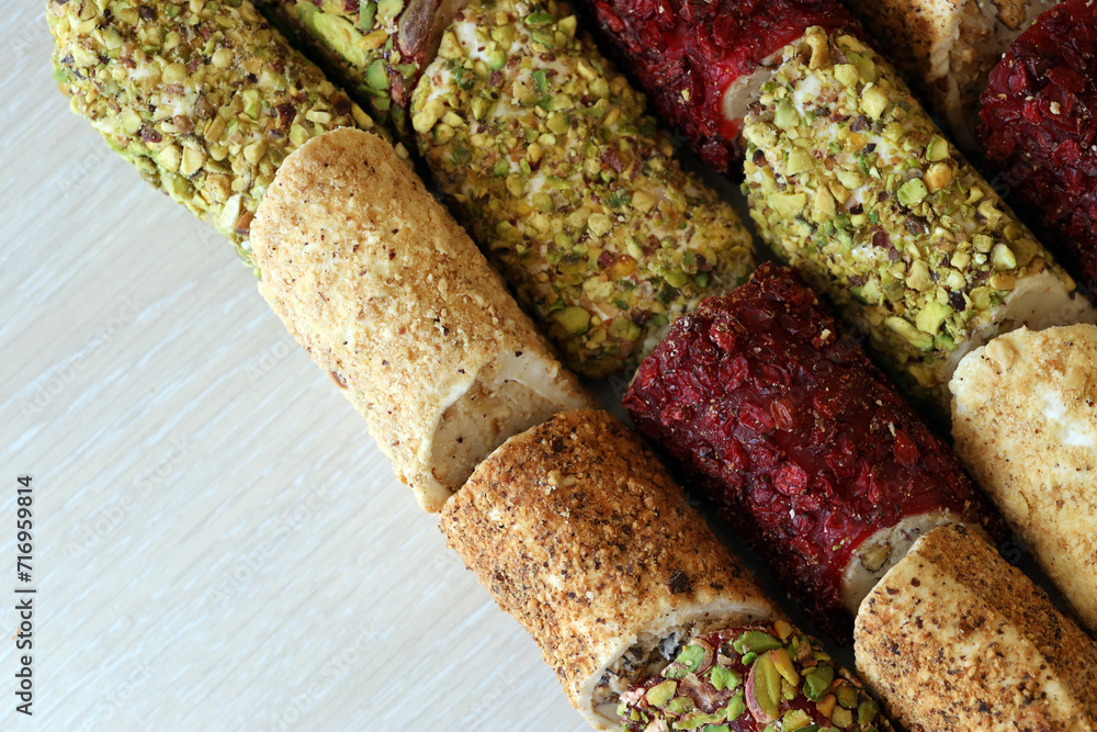 Rolls of turkish delight with many different flavors and fillings close ...