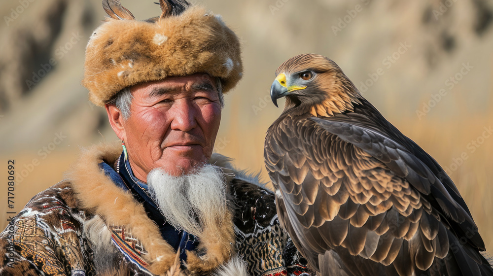 Traditional kazakh eagle hunter girl with her golden eagle that is used ...
