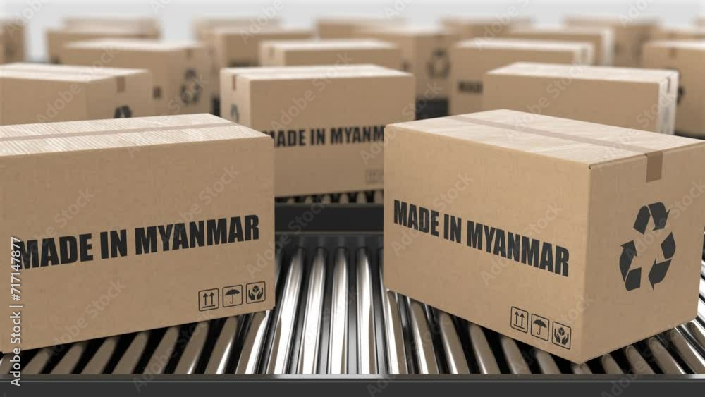 Cardboard boxes with Made in Myanmar text on roller conveyor. Factory ...