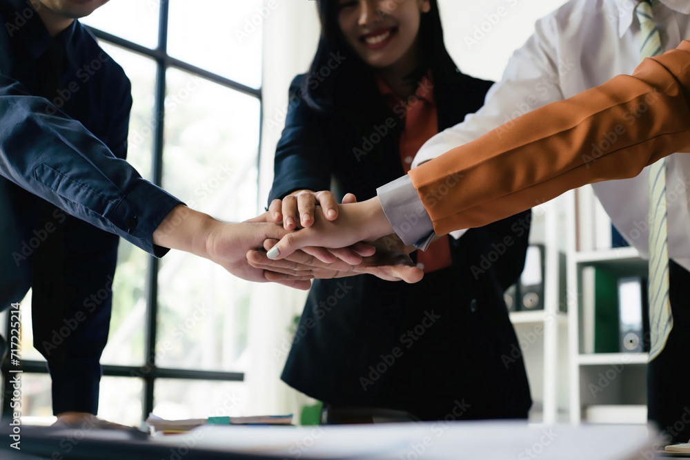 People with fist put together during support group session, Business ...
