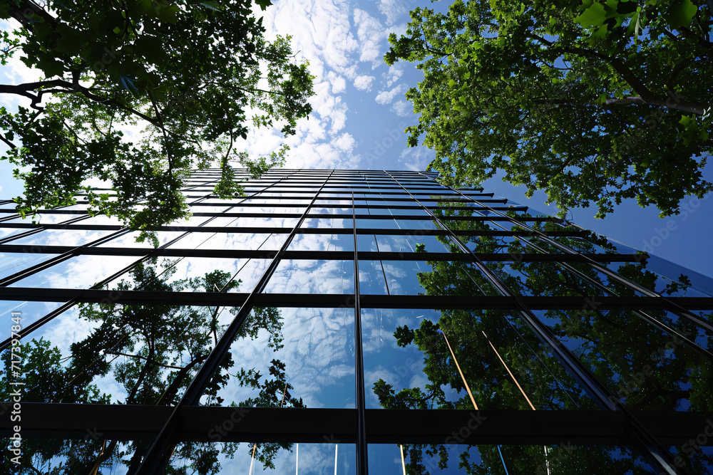 Eco-friendly building in the modern city. Sustainable glass office ...