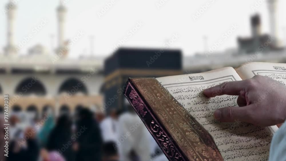 Man Reading Quran in front of the kaaba, Al haram Mecca. Muslim man reading holy Quran facing ...