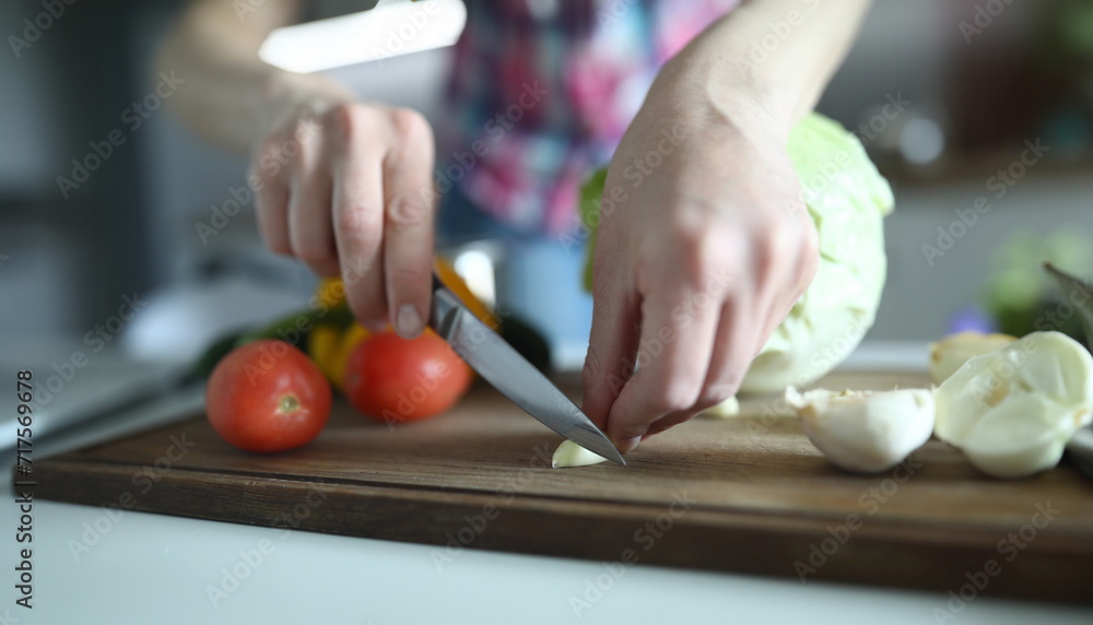 Female hands cut fresh vegetables table in kitchen. Learn art cooking. Flavoring combinations ...