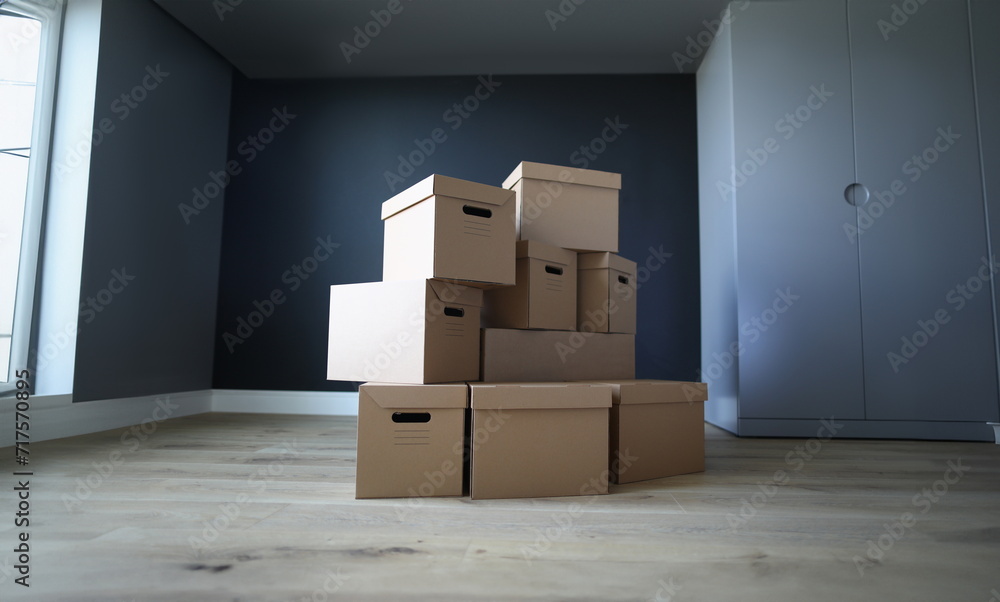 Empty cardboard boxes stand in an empty room. Empty office interior ...