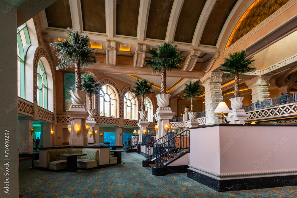 Beautiful interior with fountains and aquarium walls of the Atlantis ...