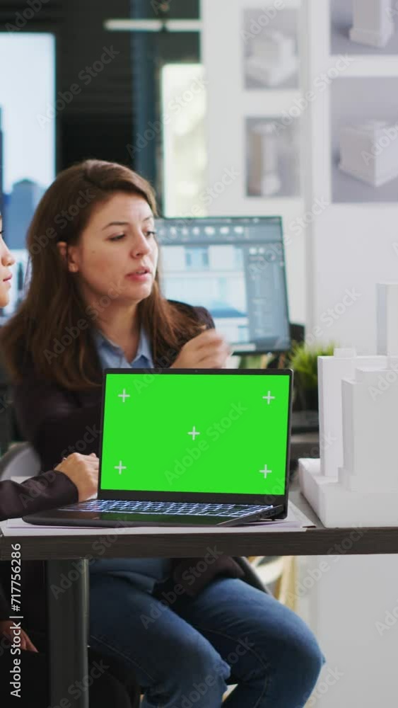 Vertical Video Team of architects working with greenscreen layout on pc ...