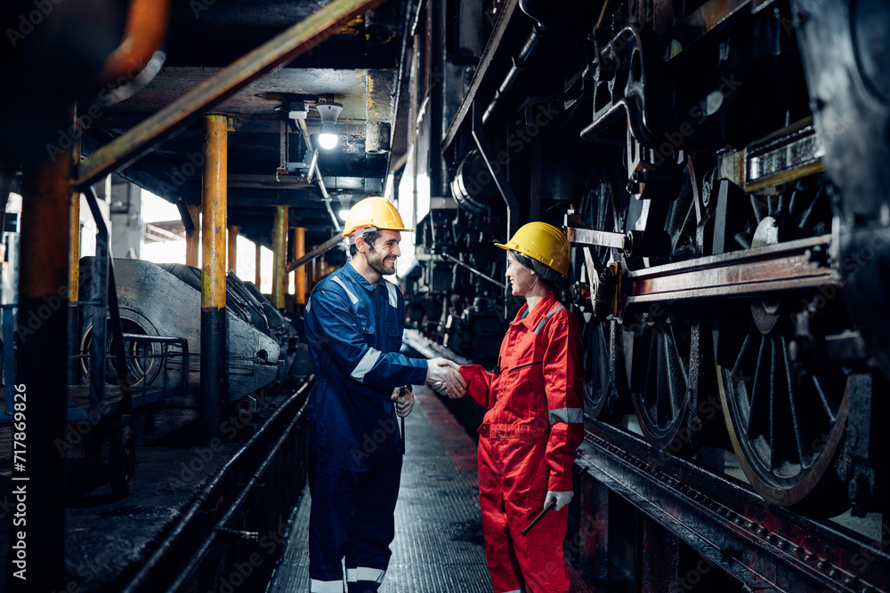 Team of engineer railway wearing safety uniform and helmet under ...