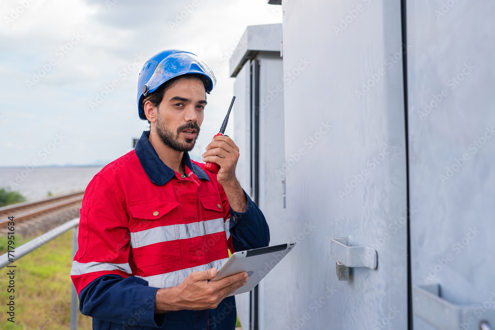 Engineer wearing safety uniform sitting on railway inspection ...