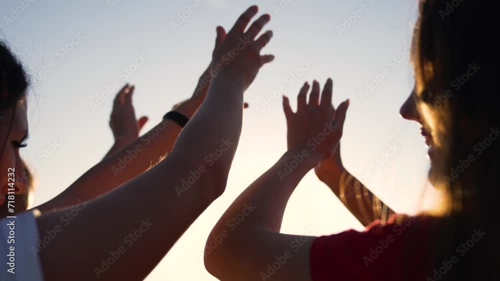 Group of people pulls their hands to sun sky. Teamwork religion and ...