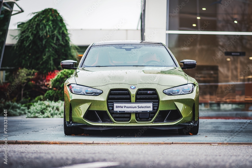 Front view of a fast BMW M4 sports car parked outside in front of a ...