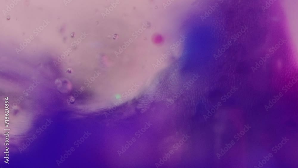 Foam bubbles. Gel fluid drop. Ink water. Defocused neon purple blue ...
