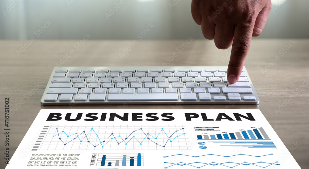 business plan Businessman at the office desk business document, plan ...