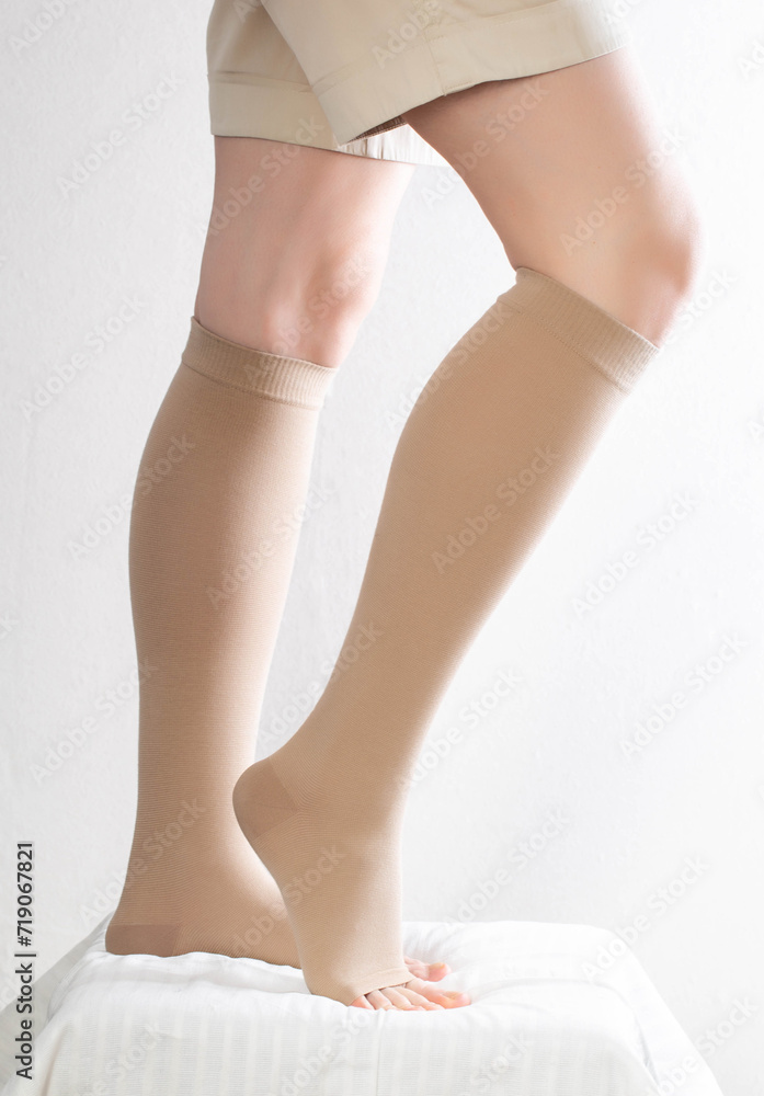 Female legs in compression stockings for varicose veins on the legs ...
