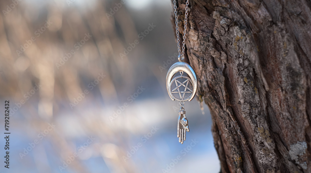 amulet with pentagram on tree, abstract natural forest background ...