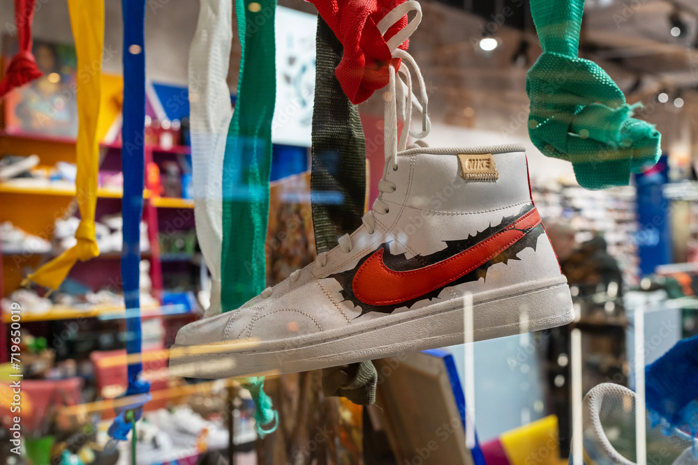 Nike sneakers in the interior of a sports shoe store. Shoe store ...