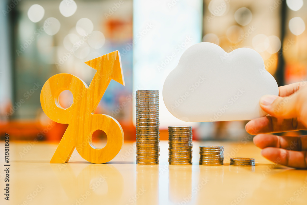 Percentage symbol with an arrow pointing up and a pile of money and a ...
