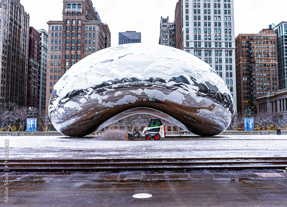 Tractor is shoveling snow near Cloud Gate or the bean at Millennium ...