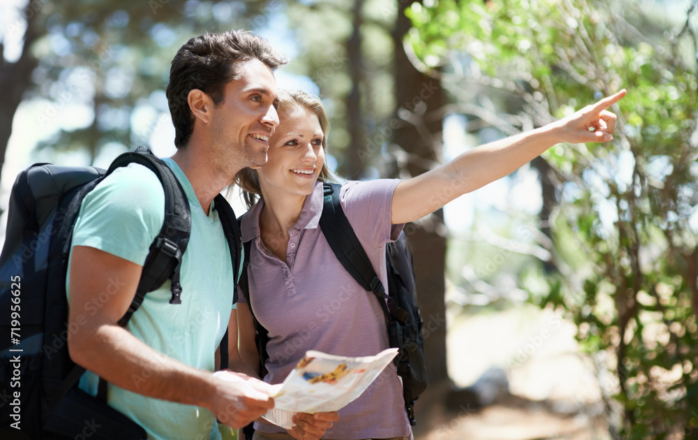 Couple, hiking in nature and map for direction, documents guide or ...