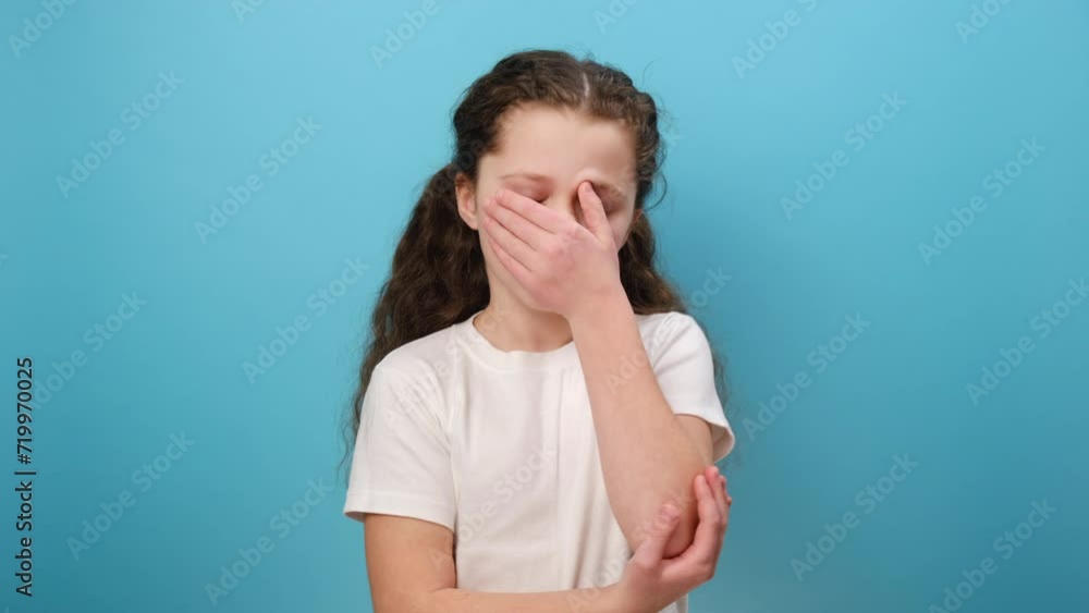 Portrait of sad preteen girl child hiding face down and crying, upset ...