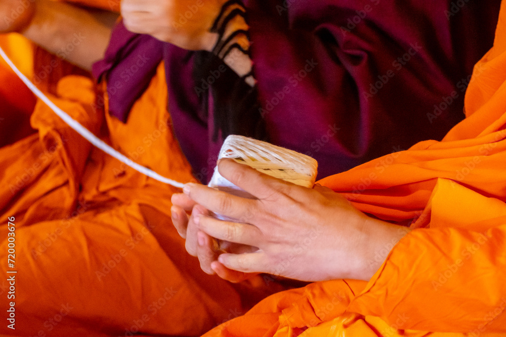 lose up monk's hand holding holy thread, buddhist holy day, thai ...