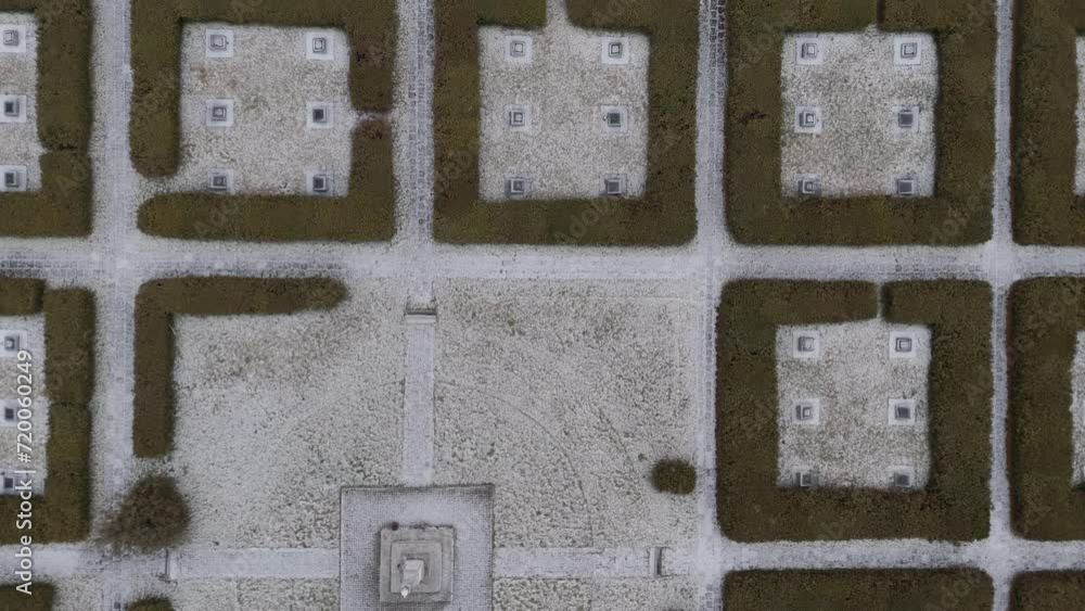 Vidéo Stock Bird's-eye view of a war cemetery, snow-dusted graves ...