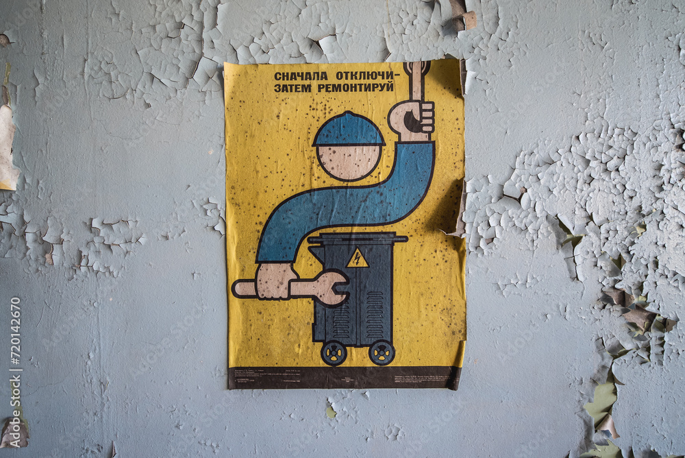 Chernobyl Zone, Ukraine - October 1, 2014: Old safety poster in Jupiter ...